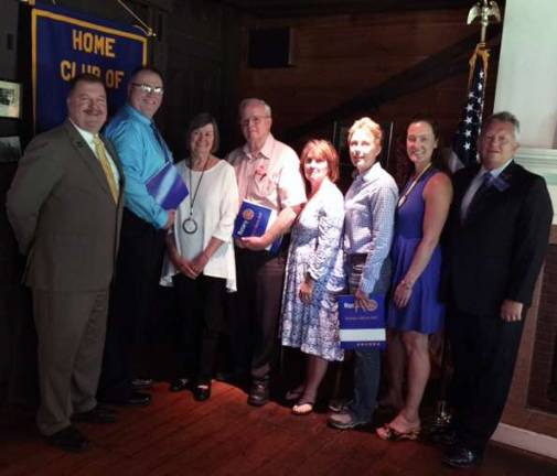 Rotary Governor installs three new members into Warwick Club